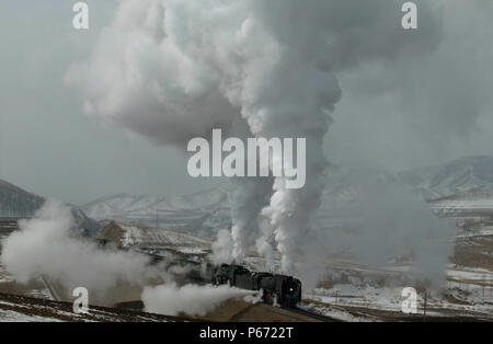 A pair of QJ Class 2-10-2s in the steam testing shed at Datong ...