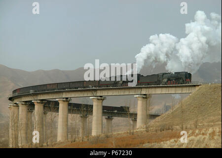 A pair of QJ Class 2-10-2s in the steam testing shed at Datong ...