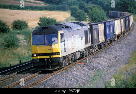 Class 60 diesel-electric locomotive in Colas Rail livery hauling a log ...