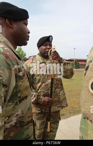 Col. Landis Maddox (left), commander of the 25th Division Sustainment ...