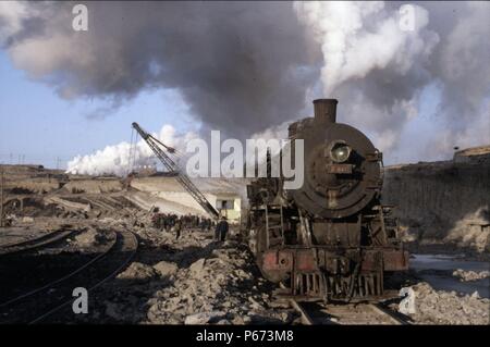A China Railway JF Class Mikado draws a heavy rake of wagons through ...