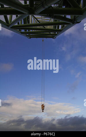 A barge with a crawler crane and a piling machine awaits it's next job ...