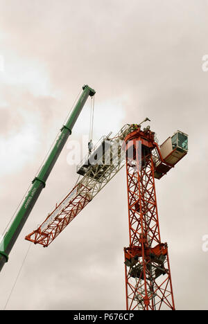 Crane lifting steel reinforced cage into an excavated pile. Concrete ...