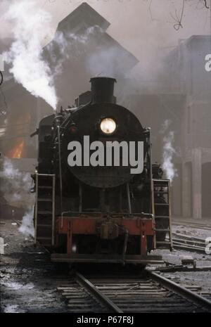 A Chinese Class PL2 industrial Prairie waits to draw a rake of Cauldron ...