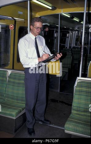 British Rail worker inspecting the railway tracks at Worstead old ...