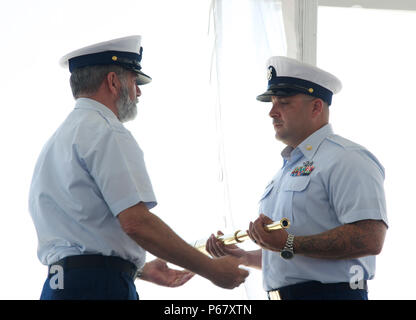 U.S. Coast Guard plank owners stand at parade rest during during the ...