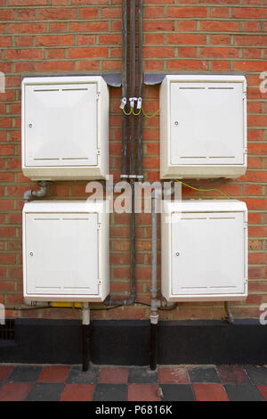 Four gas meter cupboards outside a private house Stock Photo - Alamy