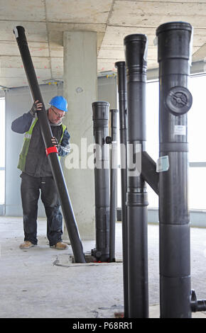 Plastic soil and waste drainage pipes in basement of a new London tower ...