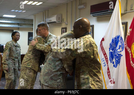 Division Chaplain (Lt. Col.) David Bowlus hugs his son Andrew, while ...