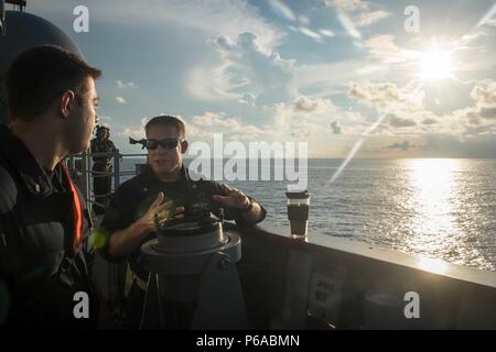 Lt. instructs Ensign on watch standing duties as officer of the deck ...