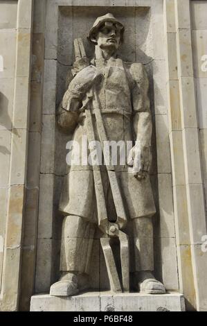 Poland. Warsaw. Socialist relief. Constitution Square Stock Photo - Alamy