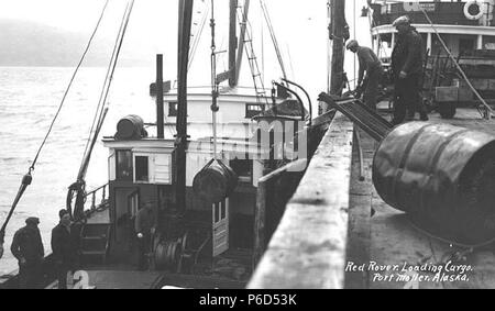 Loading cargo onto the cannery tender RED ROVER, Port Moller, ca 1912 ...