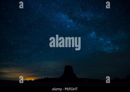 beautiful devil tower at night with milkyway in clear night sky ...