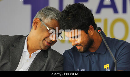 Sri Lankan Sports minister Faiszer Musthapha (L) speaks with Sri Lanka ...