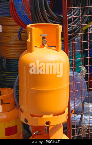 Orange gas cylinder for home use Stock Photo - Alamy