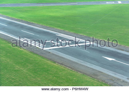 Aircraft plane grass runway airstrip hanger buildings rural countryside ...