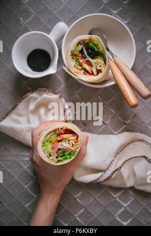Sandwich Wrap, cross section, table set up Stock Photo - Alamy