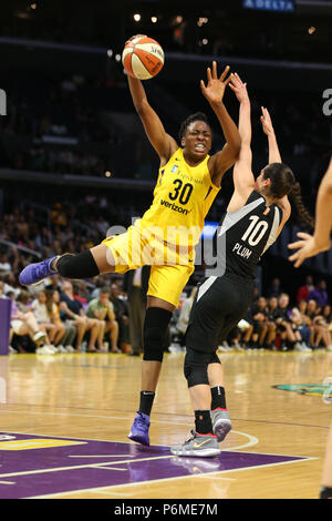 Los Angeles Sparks' Kelsey Plum, right, poses with her jersey with ...