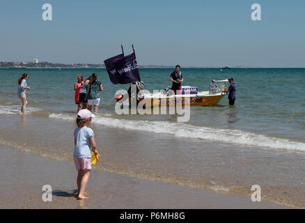 an Ice cream boat sells ice-cream to tourists in very warm weather June ...