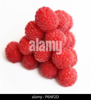 The pyramid of ripe raspberry over white background Stock Photo - Alamy