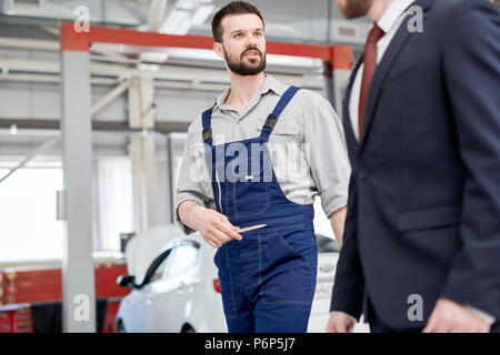 Giving Tour of Factory Stock Photo - Alamy