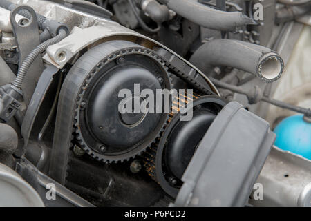 Old torn car timing belt isolated on white background Stock Photo - Alamy