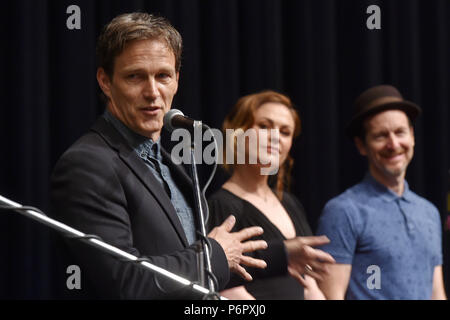 Stephen Moyer, left, and Anna Paquin arrive at the premiere of ...