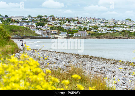 People walking on the beach at Benllech on the Isle of Anglesey Stock ...