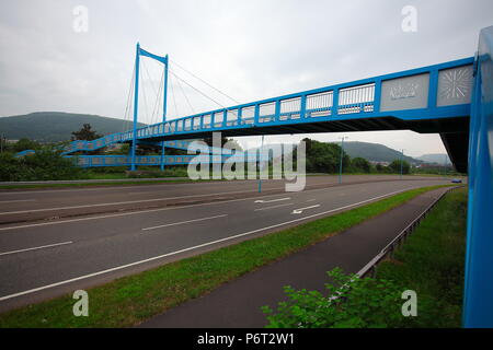 A fairly newly constructed road crossing bridge for pedestrians and ...