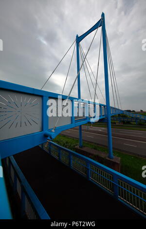 A fairly newly constructed road crossing bridge for pedestrians and ...