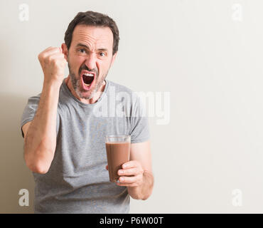 Senior man annoyed and frustrated shouting with anger, crazy and ...