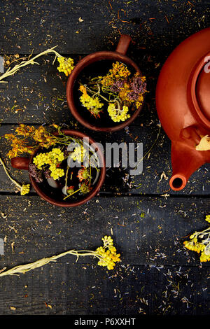 Two Cup of herbal tea - tutsan, sagebrush, oregano, helichrysum ...