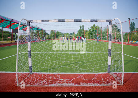 Small soccer field with mini football goal on the children playground ...