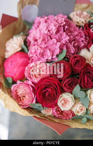 Pink peonies and red hydrangea. Beautiful bouquet of mixed flowers in ...