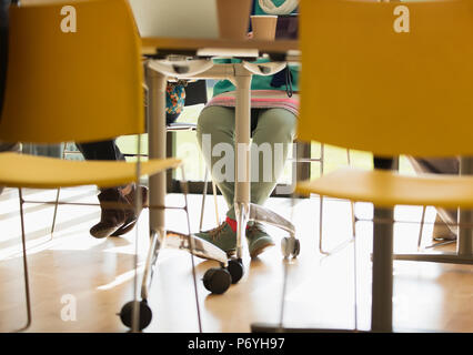 woman s legs under table in restaurant Stock Photo - Alamy