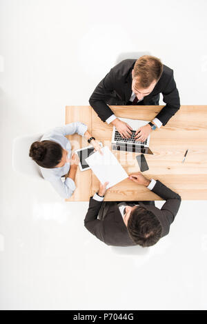 Overhead view of business team having meeting at conference table Stock ...