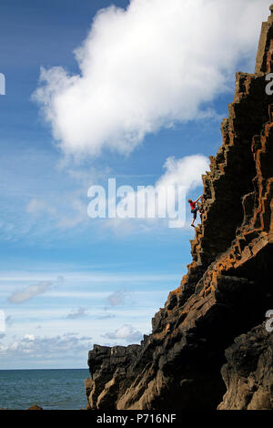 Rock climber in action, Culm Coast, North Devon, England, United ...