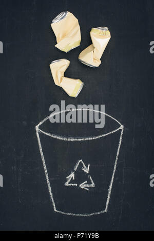 Garbage falling into trash bin on white background Stock Photo - Alamy