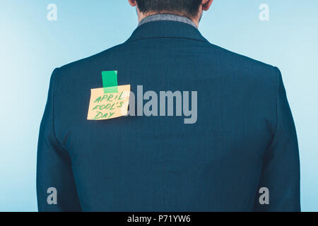 Business people, joke and fool's day concept - young funny businessman ...