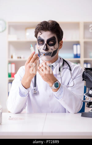 Scary monster doctor working in lab Stock Photo - Alamy
