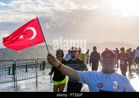 A man holding a Turkish flag outside The Basilica Cistern in Istanbul ...