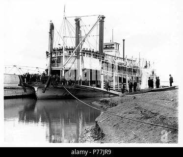 Stern wheel steamer HANNAH tied up to riverbank, ca 1904 Stock Photo ...