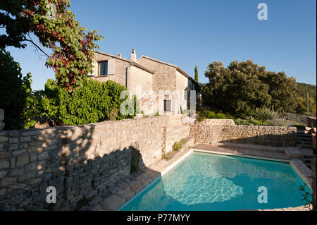 Swimming pool by rustic stone walls Stock Photo - Alamy