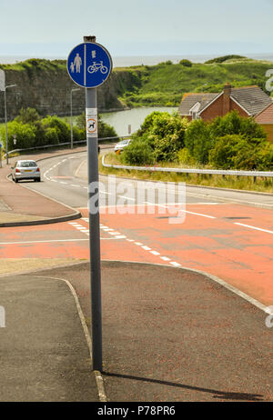 Separation sign for cyclists and pedestrians on a city street. Traffic ...