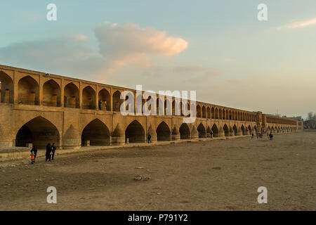 Dried riverbed of Zayandeh river with Khaju Bridge in background ...