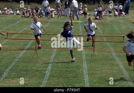 The hurdles race at a primary school sports day Stock Photo: 85398439 ...