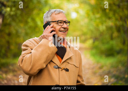 happy man calling on smartphone at home Stock Photo - Alamy