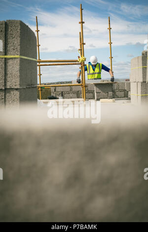 construction worker check the level on the wall Stock Photo - Alamy