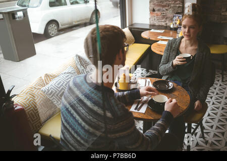 Man and woman talking over coffee Stock Photo - Alamy
