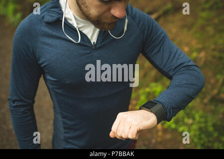 man checking time on smartwatch, copy space Stock Photo - Alamy